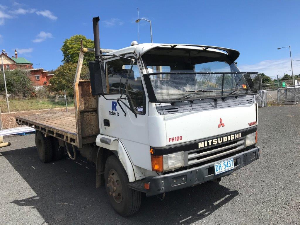 Lot 34 - 1993 Mitsubishi FH100 Turbo flat tray truck | AuctionsPlus