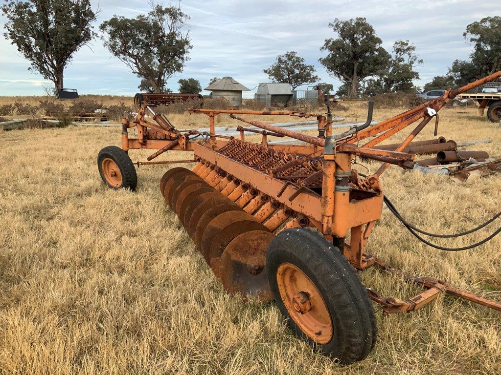 Lot 4 - Orange model 14 disc Chamberlain plough | AuctionsPlus