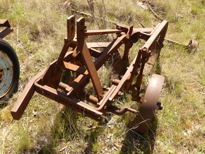 Lot 49 - Antique Steel Wheel 3 furrow Mulboard Plough | AuctionsPlus