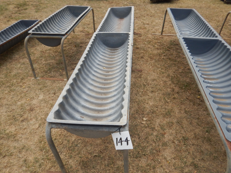 Lot 144 - 1 x ( 2 x 5' ) Poly feed troughs on heavy pipe frame ...