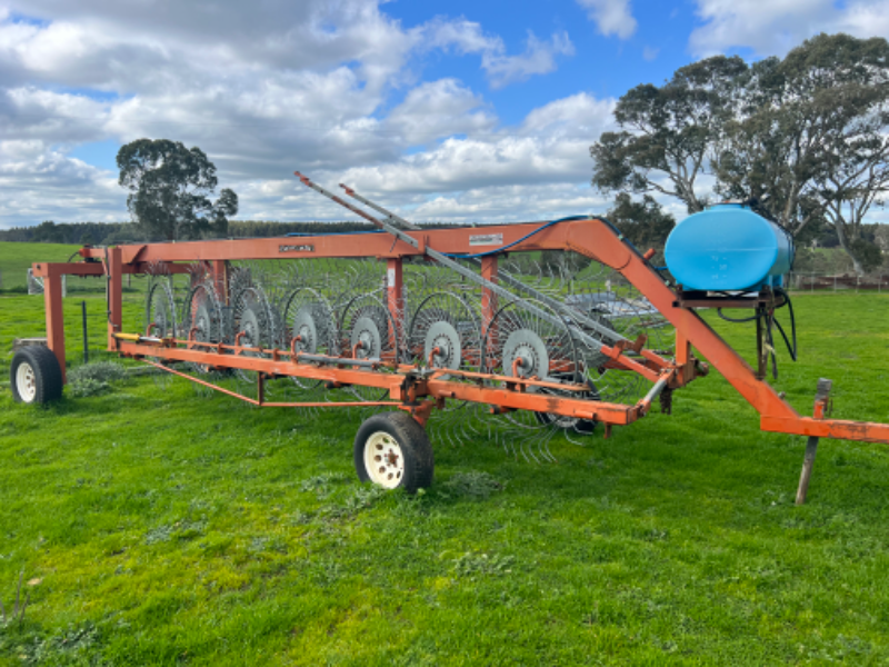Lot 134 - Schinckel 14 Wheel V Rake with inoculant tank | AuctionsPlus