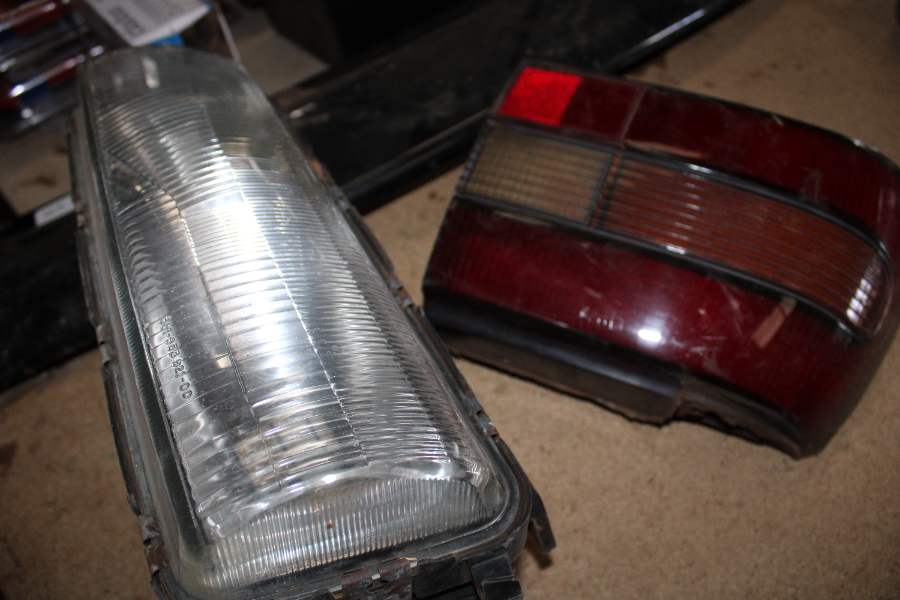 Lot 31 - Commodore Parts. Rear window shade, headlight, Tail light ...