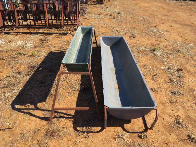 Lot 149 - 2x poly feed troughs with steel frames (6ft & 8ft) | AuctionsPlus
