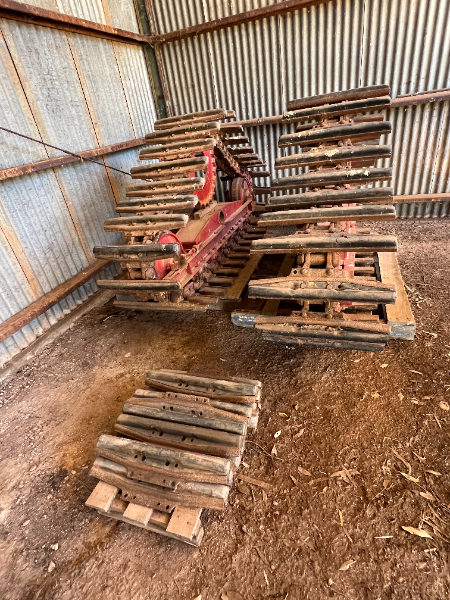 Lot 60 - Rice Header Tracks, 6 Roller with spare lugs | AuctionsPlus