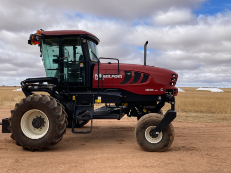 Lot 7 - MacDon M155 Windrower & MacDon D65-D Draper Front | AuctionsPlus