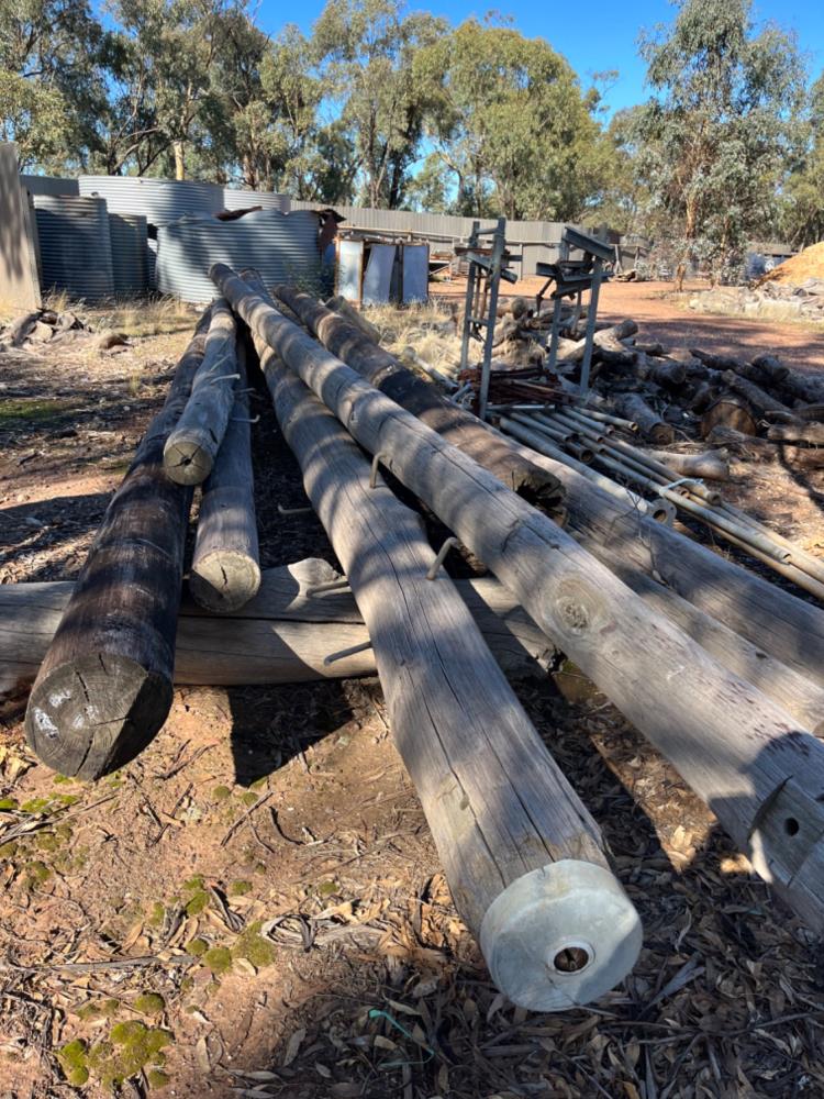Lot 55 - 8 wooden power poles | AuctionsPlus