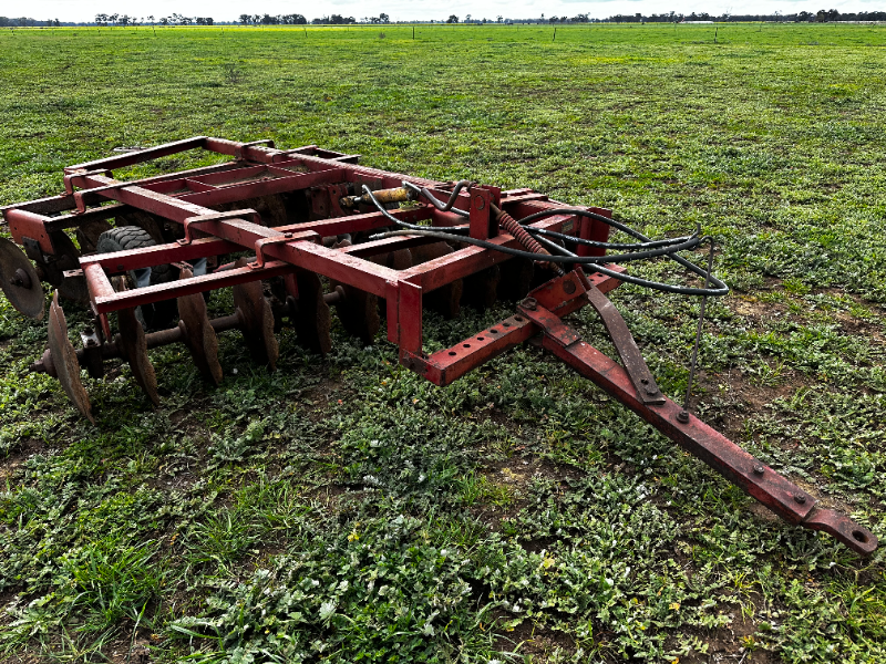Lot 32 - International 24 Plate Offset Plough | AuctionsPlus