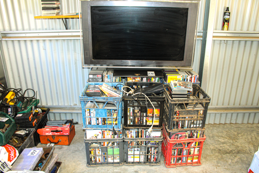 Lot 276 - TV, DVD Player and over 850 DVD's | AuctionsPlus
