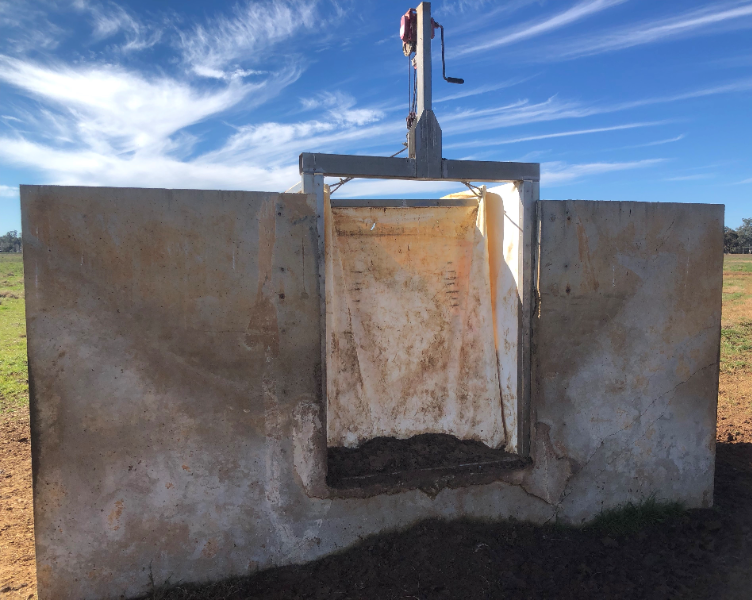 Lot 1 - Concrete Winged L Stop Weir with Winch Control Tarp | AuctionsPlus