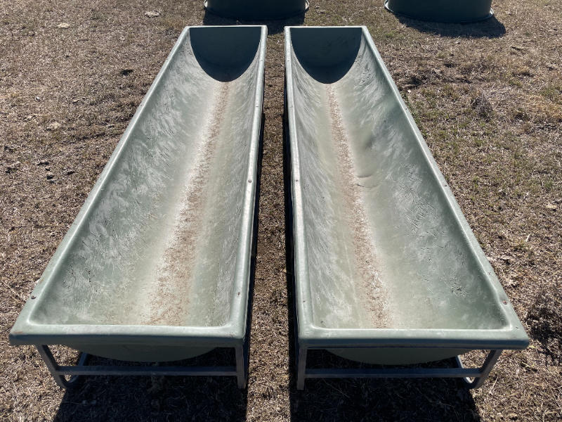 Lot 31 - 2 x Green feed plastic troughs on steel frames | AuctionsPlus