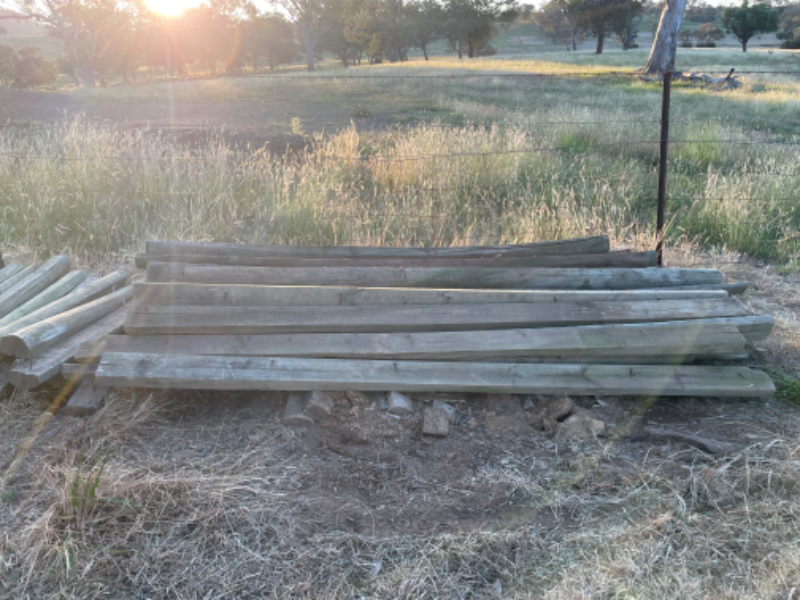 Lot 172 - 28 x Treated Pine Half Logs | AuctionsPlus