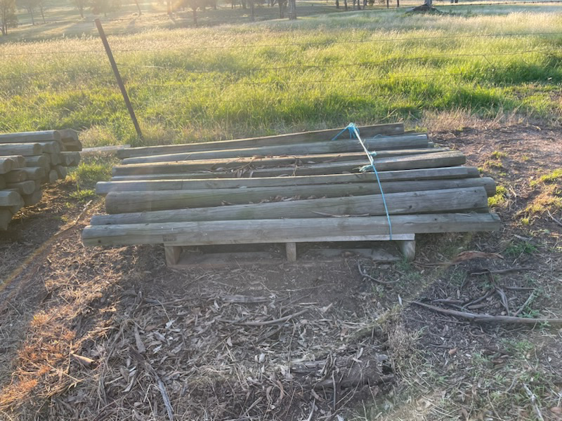 Lot 173 - 26 x Treated Pine Half Logs | AuctionsPlus