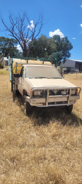 Lot 72 - Nissan Ute with Spray Boom | AuctionsPlus
