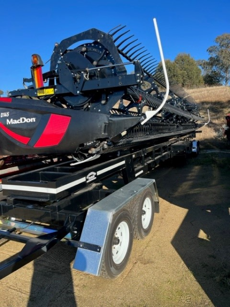 Lot 23 - MACDON D145 DRAPER FRONT AND TRAILER | AuctionsPlus