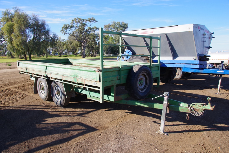 Lot 28 - Bogie axle farm trailer with steel tray & rack | AuctionsPlus