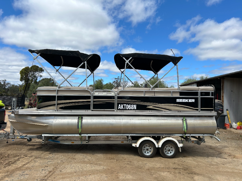 Lot 282 - 2020 Seeker Pontoon Boat on Precision Boat Trailer | AuctionsPlus