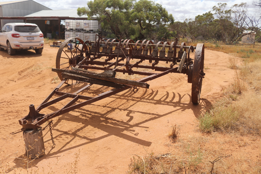Vintage stick rake, 3.5m, branded ‘Steel Rolling Company’. | AuctionsPlus
