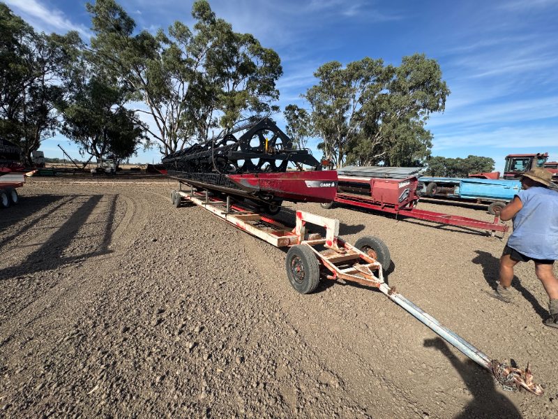 Lot 24 - 2004 36' Case Macdon Draper Front on Trailer | AuctionsPlus