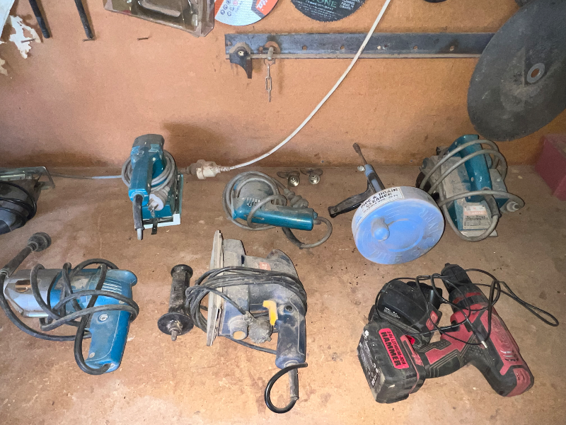 Lot 84 - Power tools, grinding discs, drills, sanders, Makita drop saw, hand saws, assorted ...