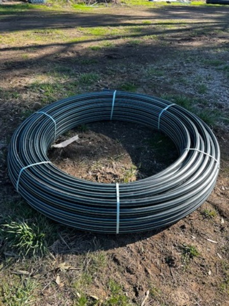 Lot 101 - 1 new roll of 2 inch green line poly pipe x 200m roll ...
