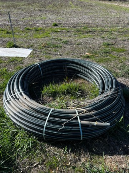 Lot 102 - 2 inch green line poly pipe 200m roll. | AuctionsPlus