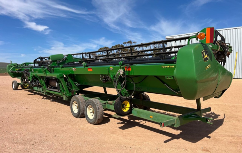 Lot 10 - John Deere 640D Header Front & Trailer | AuctionsPlus
