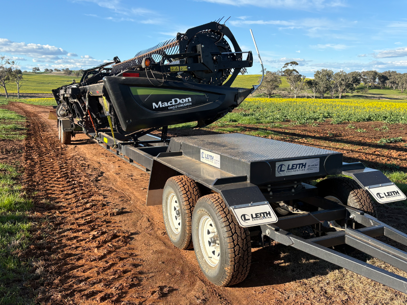 Lot 14 - Macdon D65 Draper Front on Trailer | AuctionsPlus