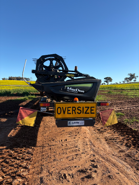 Lot 16 - Macdon D65 Draper Front on Trailer | AuctionsPlus