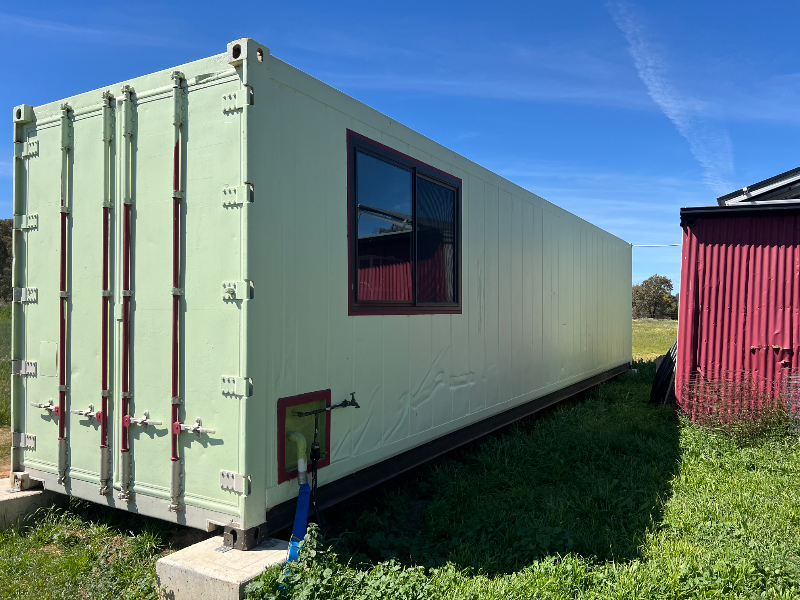 Lot 195 - Modified/Insulated Shipping Container | AuctionsPlus