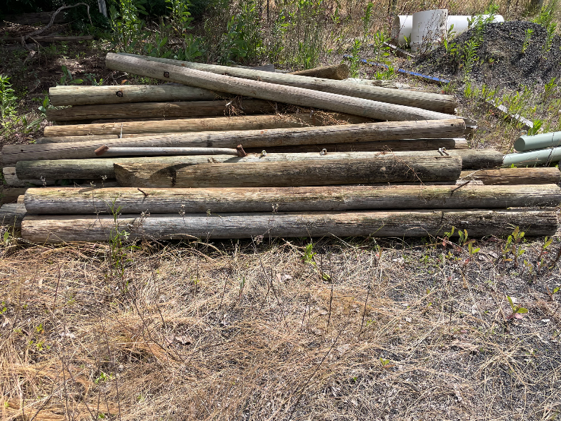 Lot 140 - Pine posts ( treated round) | AuctionsPlus