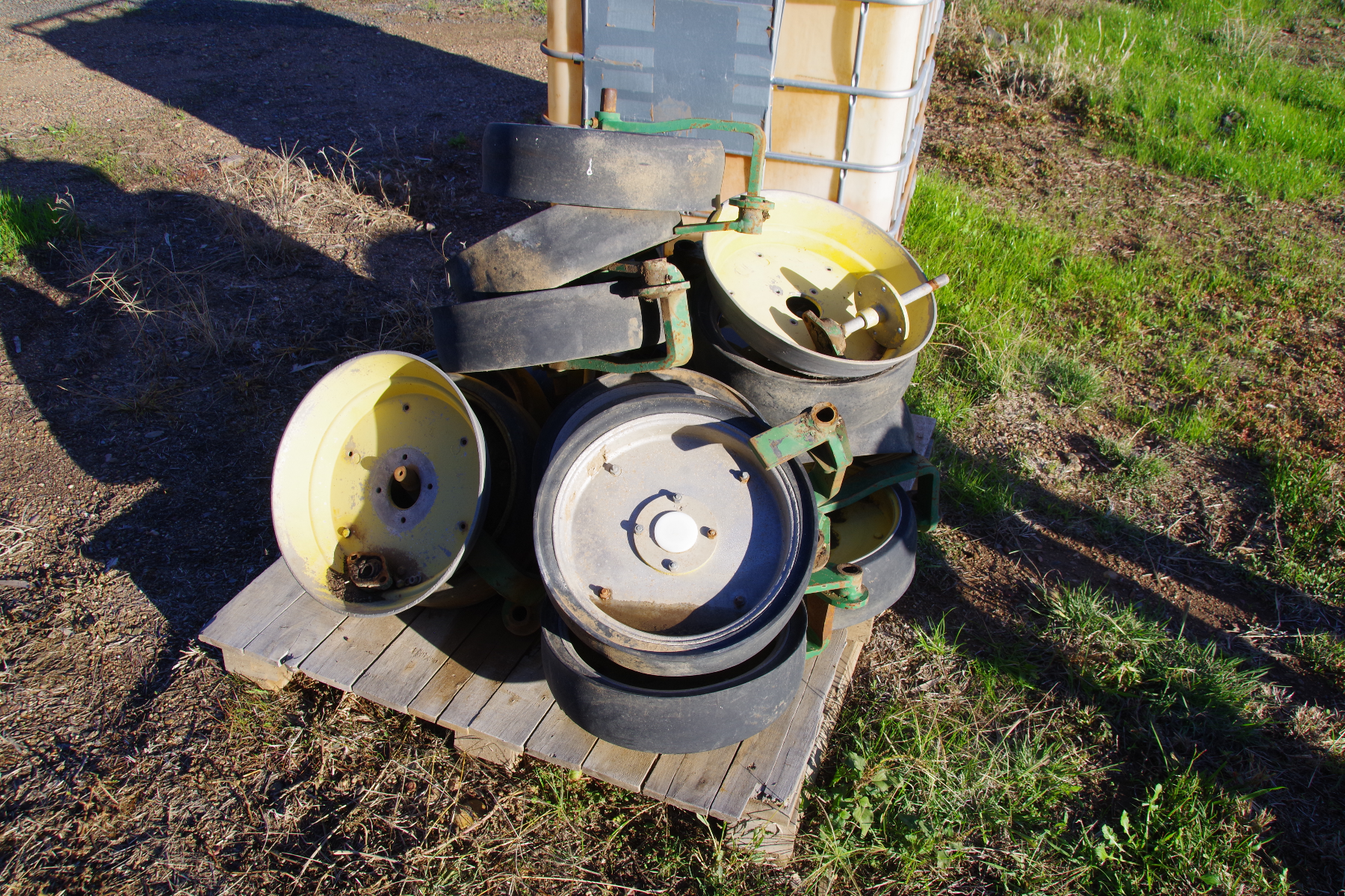Lot 229 - Planter gauge wheels plus arms | AuctionsPlus